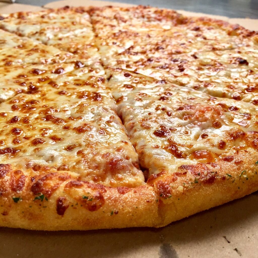 Domino's slices 50% off regular pizza prices for one week - Living On ...